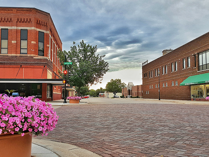 Petunias with attitude! Kearney's brick-paved downtown serves small-town charm with a side of dramatic sky that would make any cinematographer swoon.