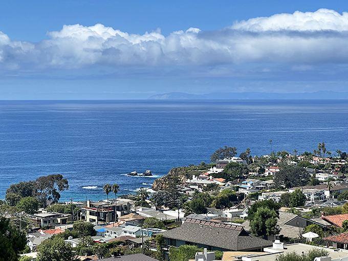 Crystal clear water and rocky coves create the kind of beach scene that makes snorkeling actually worth it.