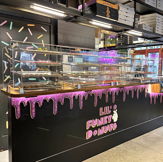 Lil' Funky's display case is a psychedelic dream come true. These aren't just donuts—they're edible art projects with attitude.