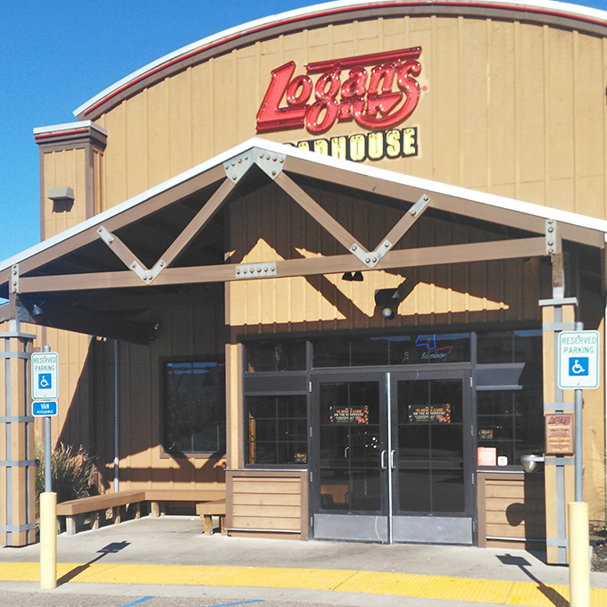 The familiar Logan's sign means reliable steaks and peanut shells on the floor ahead.