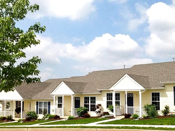 Soft yellow exteriors with bright white trim create a row of sunny dispositions—like a neighborhood that wakes up on the right side of the bed every day.