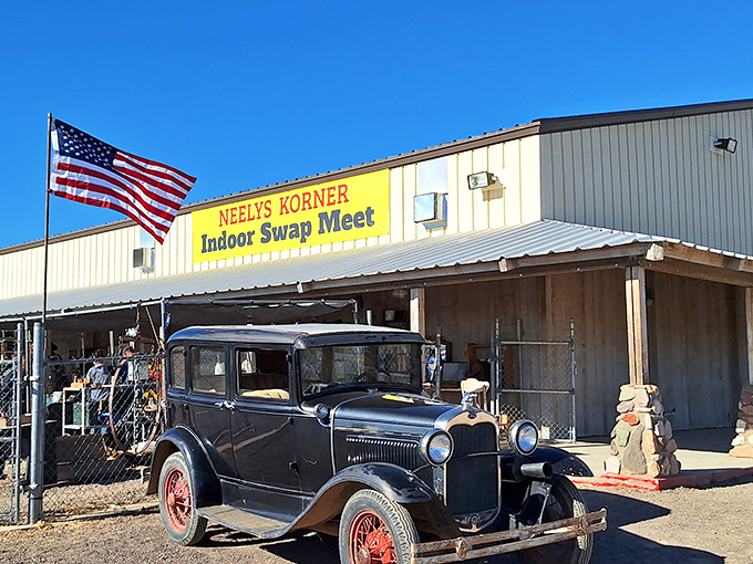 An American flag stands sentinel at Neely's, where desert winds carry the promise of unexpected treasures.