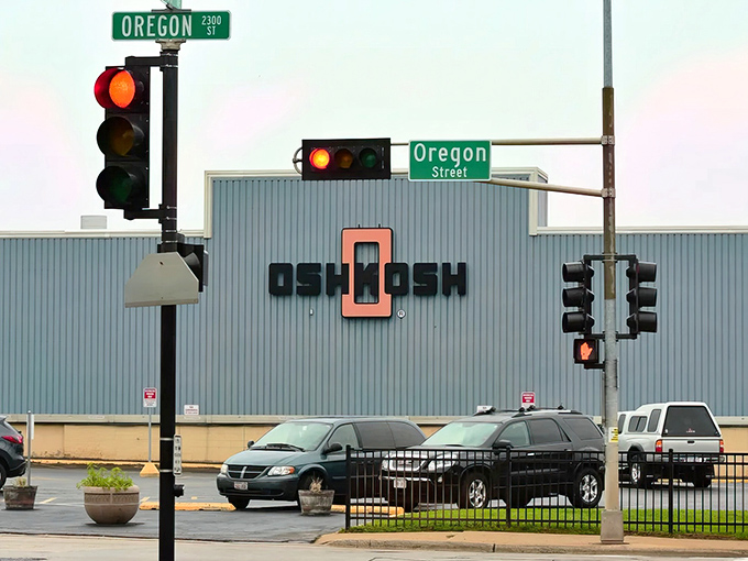 The "Oshkosh" sign might be simple, but the city behind it offers complex pleasures at simple prices for retirees watching their budgets.
