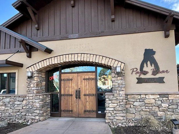 Stone archways and wooden beams create the perfect backdrop for Papa Bear's cozy pizza cave.