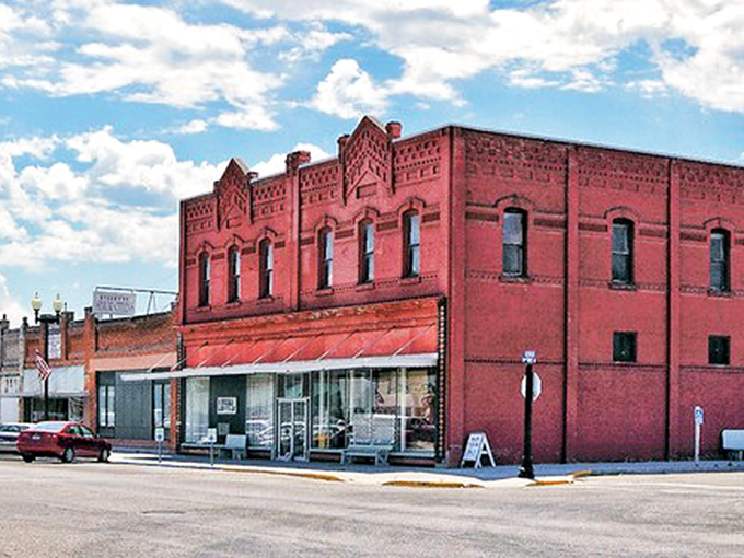 Red-brick beauty anchors this block, standing tall like the town&rsquo;s own storyteller under an endless Idaho sky.