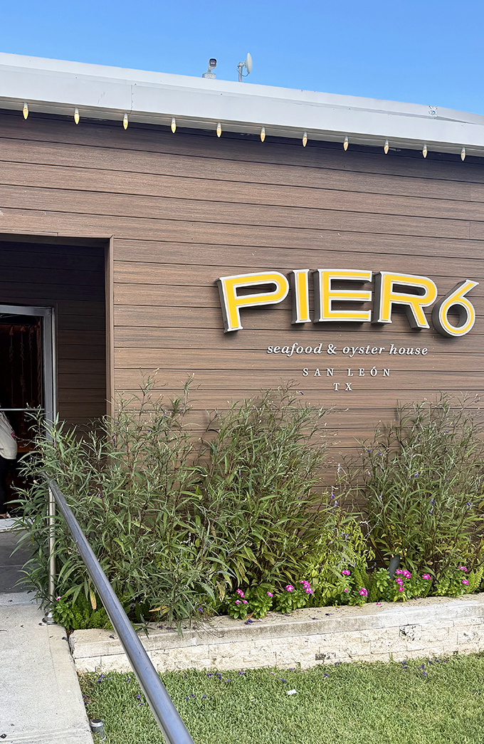 Sleek design meets seafood tradition at Pier 6, where the bright yellow sign promises good things inside.
