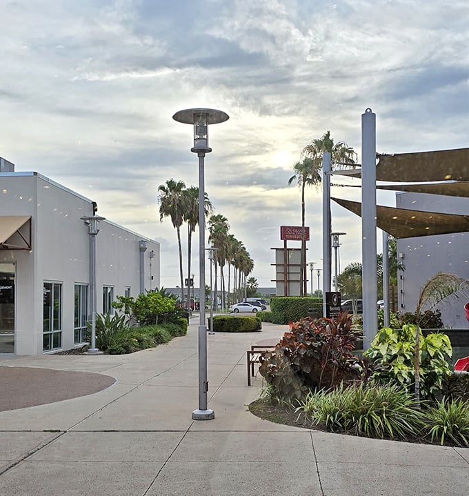 Those tropical palms create the perfect backdrop for a shopping experience that feels more like a resort getaway than errands.