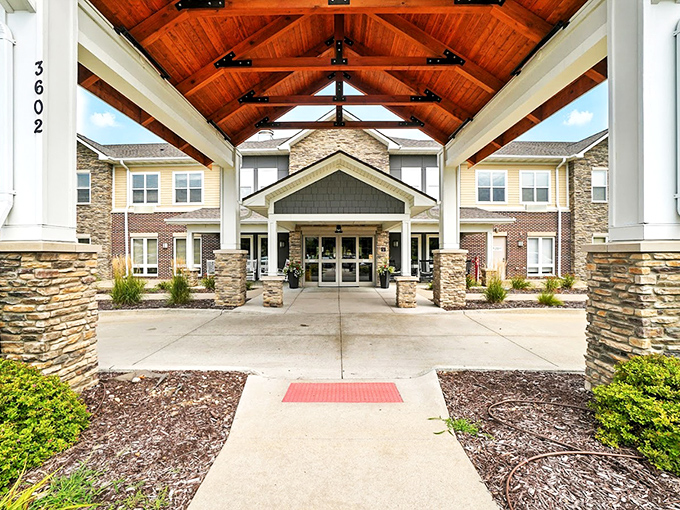 The dramatic wooden beams and soaring entrance at Rock Creek create a grand first impression that rivals luxury mountain lodges.