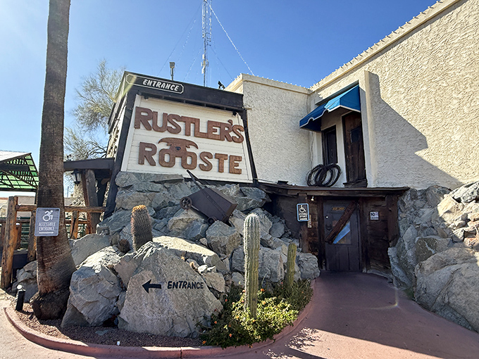 The rugged stone entrance to Rustler's Rooste looks like it was carved right out of the mountain. Desert dining with a side of adventure!