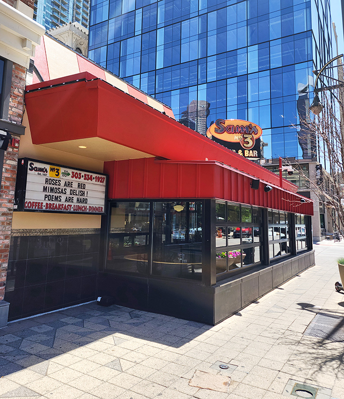 Sam's red awning waves like a flag of deliciousness over the bustling city streets below.