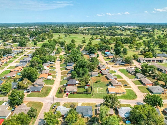 Rolling green neighborhoods stretch toward horizons filled with endless possibilities and dreams.