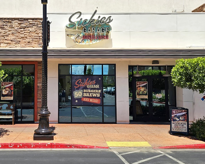 The Sickies Garage storefront proudly advertises "50 Brews and More!" Because every great burger deserves a perfect beverage companion.