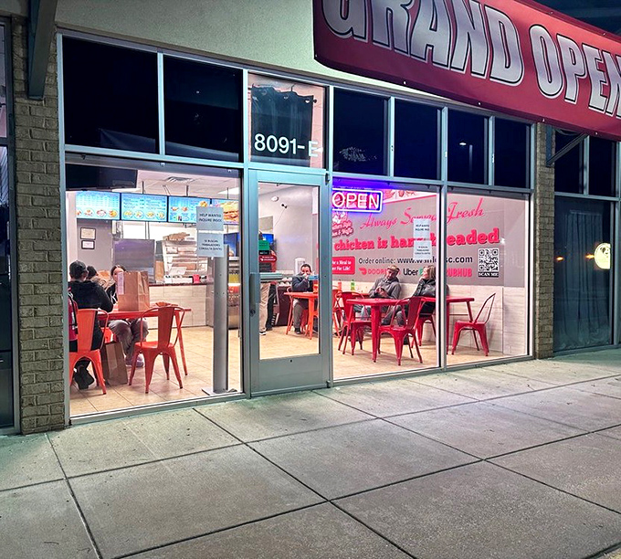 Night or day, those red chairs at Southern Style beckon you to sit and stay awhile with golden chicken goodness.