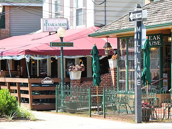That charming brick patio and quaint awning? Just clever camouflage for a steakhouse that punches way above its weight class.
