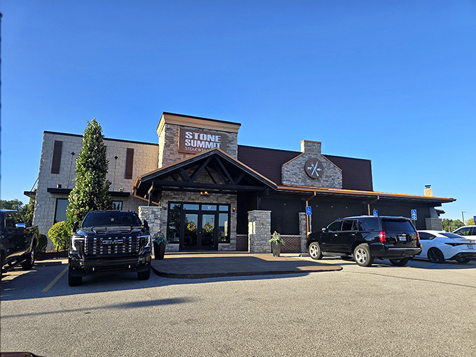 Rustic elegance defines Stone Summit's welcoming entrance. Those stone walls and timber beams practically announce "serious steak territory ahead."