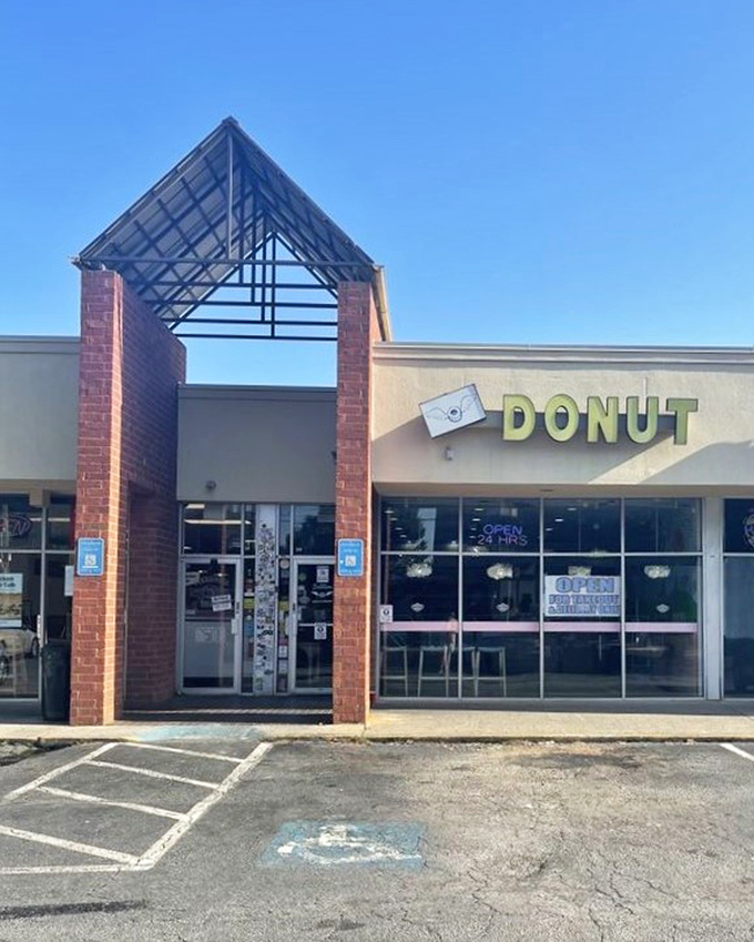 The architectural entrance frames your journey to donut paradise&mdash;it's like walking through the gates of delicious heaven itself.