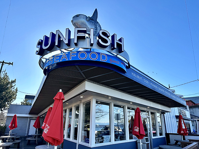 That welcoming storefront whispers promises of fresh catches and waterfront views that never disappoint.