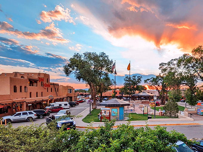 Taos Plaza at sunset captures that magical moment when the sky competes with adobe architecture for the most spectacular show in town.