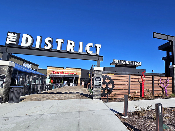 The District's contemporary entrance frames a world of retail therapy. Those colorful art elements aren't just pretty&mdash;they're conversation starters!