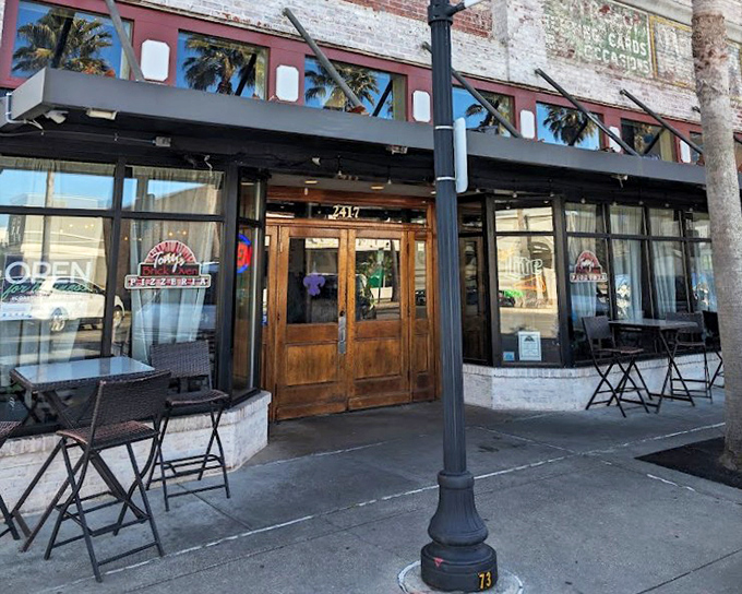 That classic brick oven storefront whispers promises of smoky, fire-kissed pizza perfection waiting inside.
