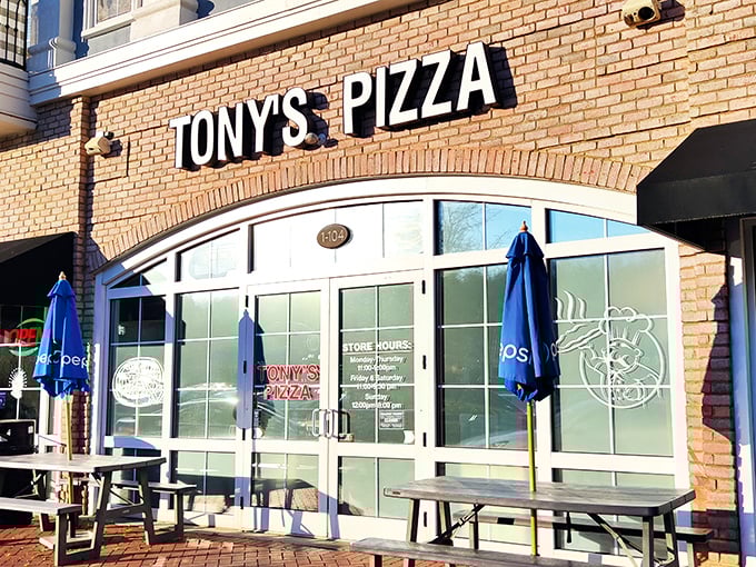 The curved windows practically wink at you. Tony's Pizza promises the kind of New York-style slices that make transplants weep with joy.