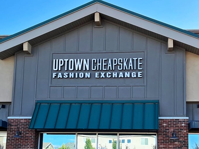 The teal awning signals "fashion ahead." Uptown Cheapskate's architectural details add a touch of class to the thrift shopping experience.