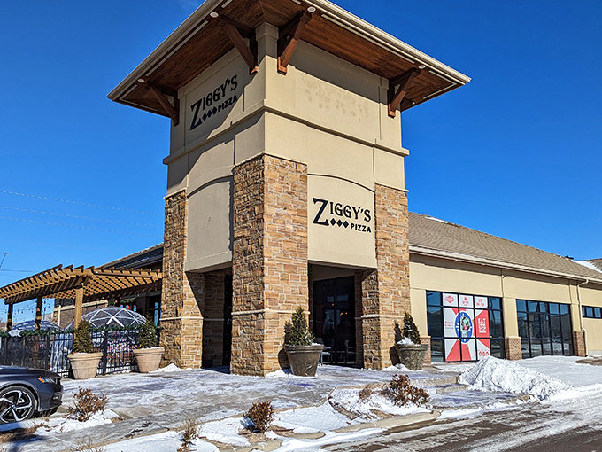 Winter can't stop pizza lovers! Ziggy's impressive stone-and-beam entrance promises warm, cheesy comfort inside its modern fortress of flavor.