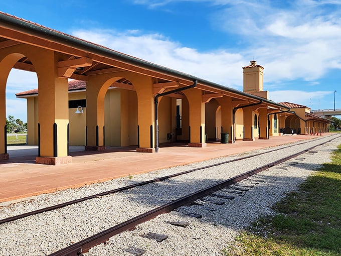 The historic Venice Train Depot whispers stories of bygone travelers, its Mediterranean arches framing memories of Florida's railroad golden age.