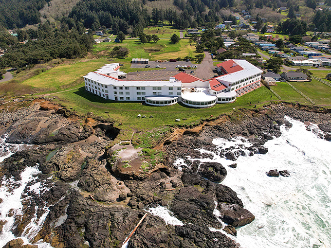 The Adobe Resort stands like a white sentinel against volcanic shoreline, where guests wake to the ocean practically high-fiving their windows.