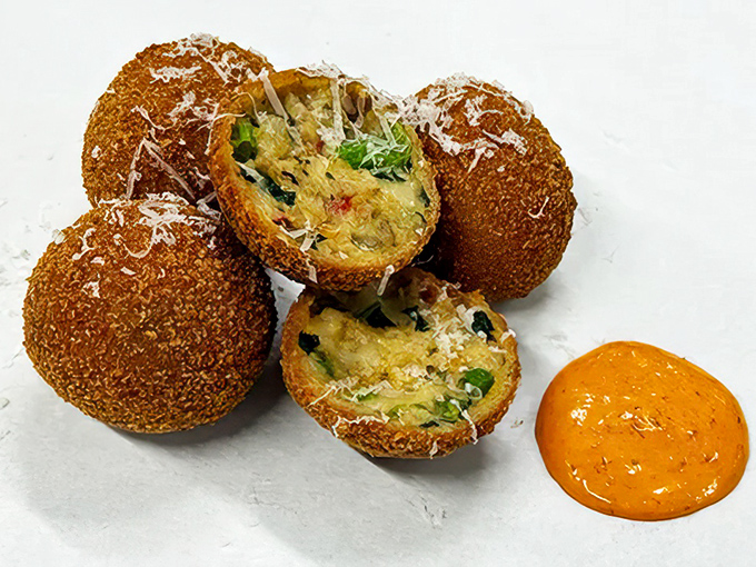 These golden arancini orbs could make even Julia Child weep tears of crispy, cheesy joy.