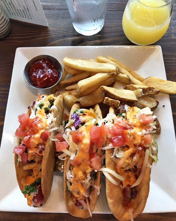 These aren't just tacos&mdash;they're edible art. Crispy shells cradle fresh ahi tuna topped with a confetti of cheese, tomato, and slaw.