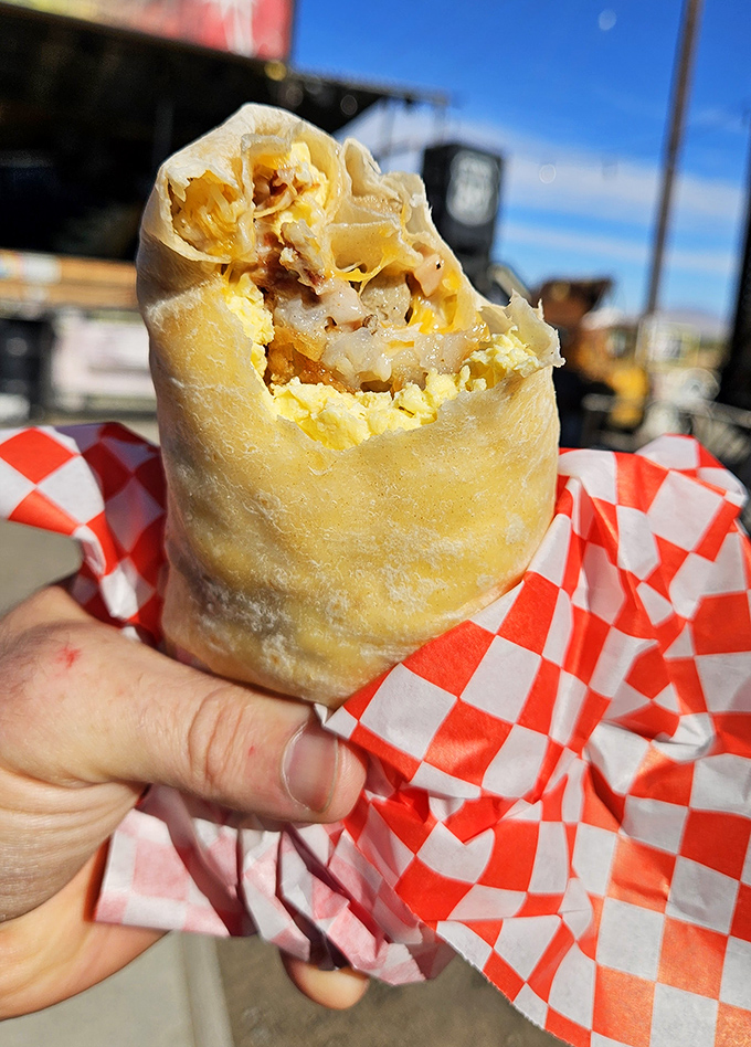 Breakfast burrito perfection: where eggs, cheese, and meat unite in tortilla harmony. The kind of hand-held masterpiece that makes morning people out of night owls.