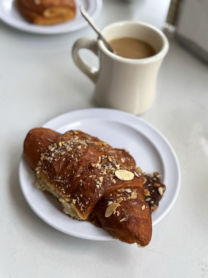 Sliced almonds, powdered sugar, and buttery perfection &ndash; this almond croissant is what angels eat when they're feeling fancy.
