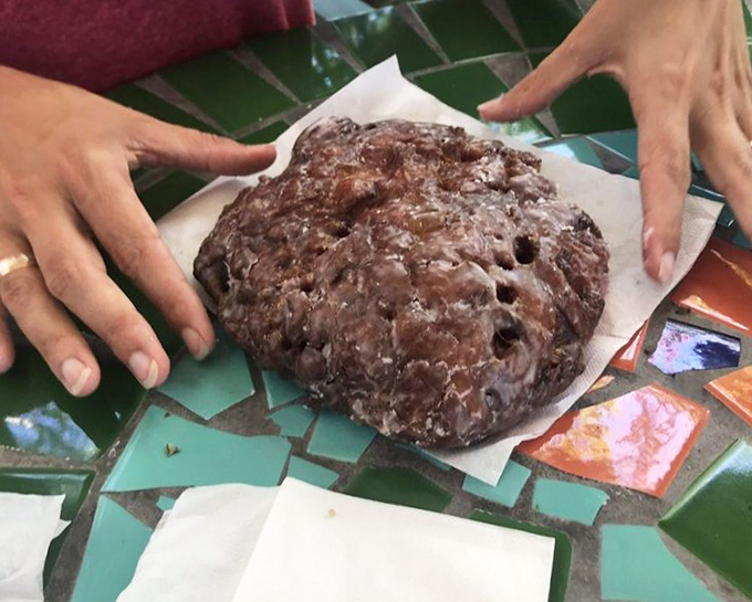 This apple fritter isn't just a donut &ndash; it's architecture. A glistening monument to what happens when apples, cinnamon, and dough meet destiny.
