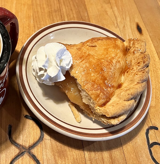 This isn't just apple pie&mdash;it's Julian's edible legacy with a flaky crust that shatters just right and a dollop of whipped cream melting into warm apple perfection.