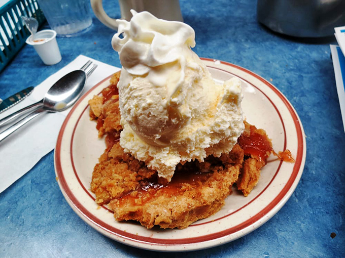 This isn't just dessert; it's a warm apple pie wearing a jaunty ice cream hat, ready to transport you back to your grandmother's kitchen.