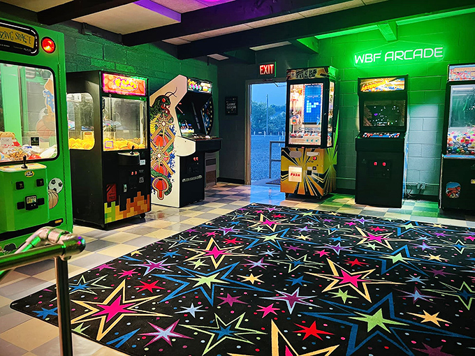 The arcade room—where neon dreams and vintage games create the perfect intermission adventure between double features.