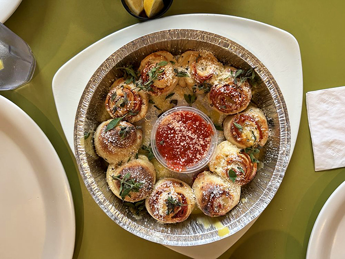 The Over-Baked Pepperoni Rolls circle the marinara like planets orbiting a delicious sun. Resistance to their gravitational pull is futile.