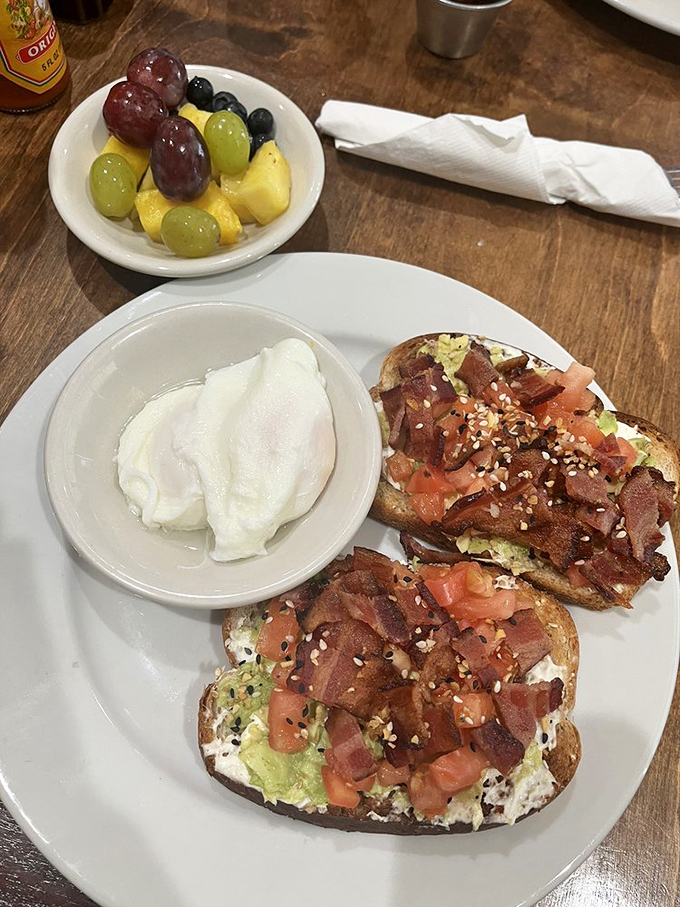 Avocado toast that doesn't require a second mortgage! Crispy bacon, fresh tomatoes, and perfectly poached eggs make this a Nebraska breakfast revolution.