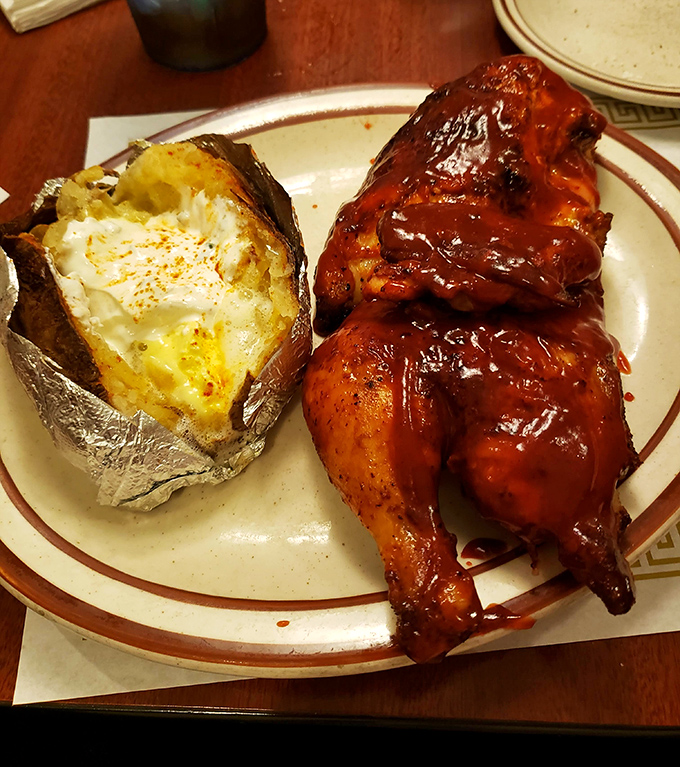 BBQ chicken nirvana achieved! That mahogany-colored skin, that tender meat, that loaded baked potato&mdash;this plate is why napkins were invented.