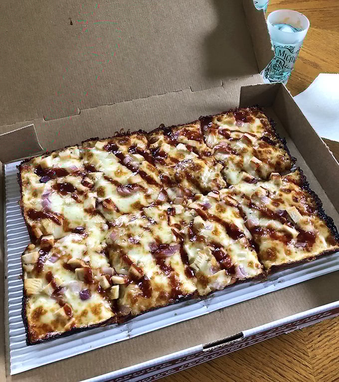 BBQ chicken pizza in its natural habitat: a cardboard box throne awaiting its brief but glorious reign.