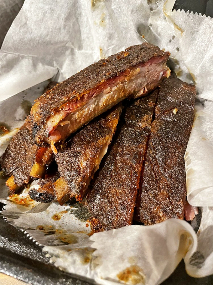 These ribs have the kind of bark that makes you sit up and beg. The perfect balance of spice, smoke, and meat that clings to the bone just enough.