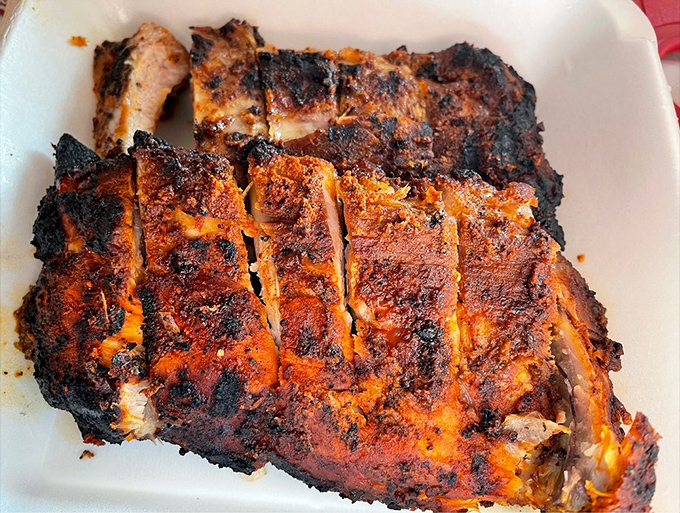 These ribs don't just fall off the bone—they practically leap into your mouth with a perfect bark that would make tree surgeons jealous.