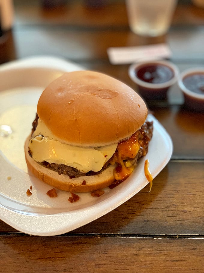 Cheese melting into beef like they were long-lost lovers finally reunited. A burger that demands both hands and your full attention.