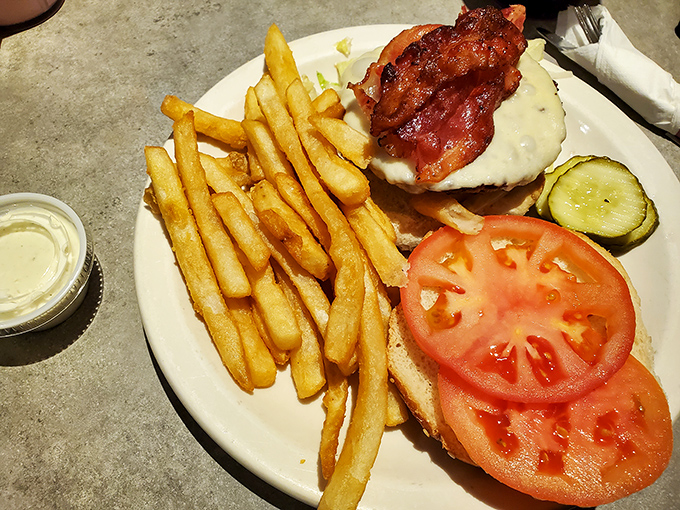 This isn't just a bacon cheeseburger&mdash;it's architecture. The golden fries, the perfectly melted cheese, the bacon standing proud like it knows what it's accomplished.