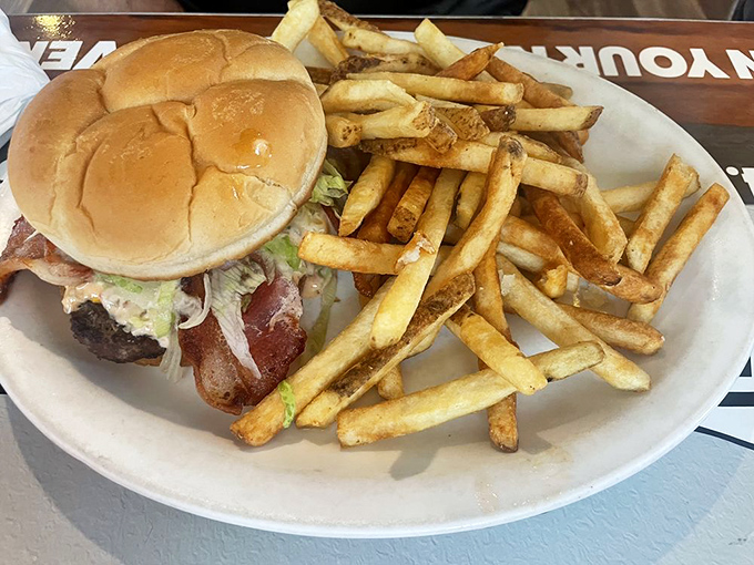 This isn't just a burger&mdash;it's architecture. The perfect stack of beef, bacon, and fresh toppings with fries so golden they deserve their own Instagram account.