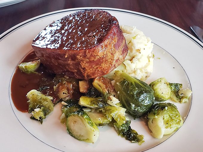 Bacon-wrapped meatloaf that would make your grandmother simultaneously proud and jealous. The Brussels sprouts provide the illusion of virtue.