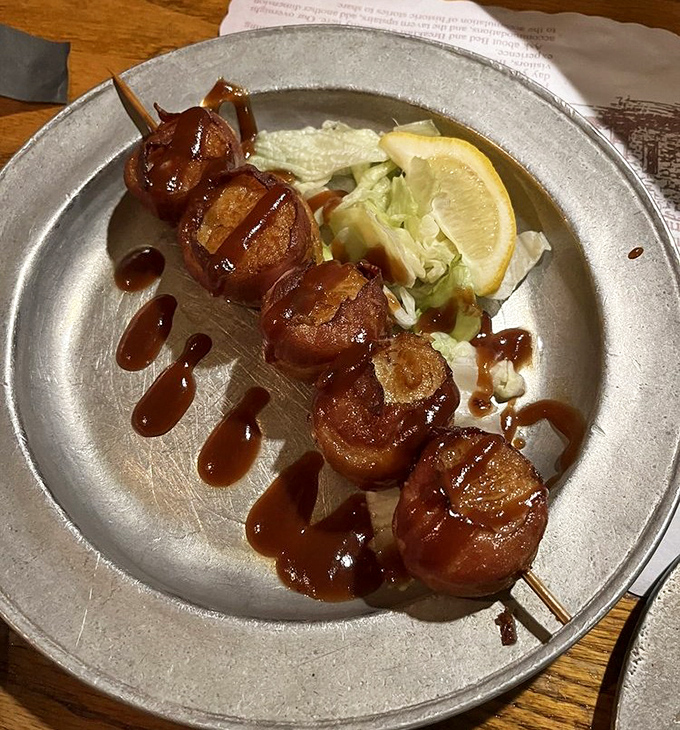 Bacon-wrapped scallops lined up like delicious soldiers, ready to march straight into your heart. The sweet-savory combination is simply irresistible.