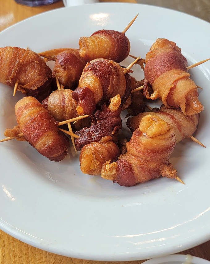 Bacon-wrapped shrimp: Because the only thing better than shrimp is shrimp wearing a bacon tuxedo. Formal seafood at its finest.