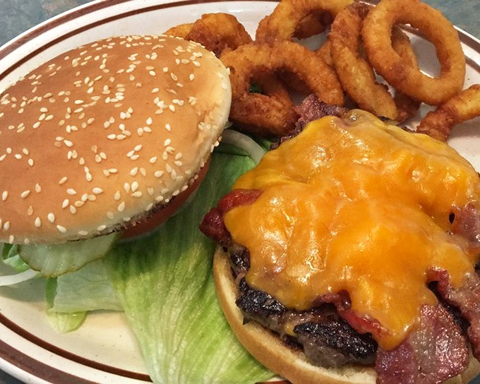 This bacon cheeseburger doesn't need fancy aioli or artisanal buns&mdash;just honest beef, melty cheese, and those perfect onion rings.
